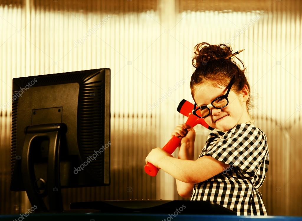 Nerdy girl smashing her computer Stock Photo by ©creatista 39760137