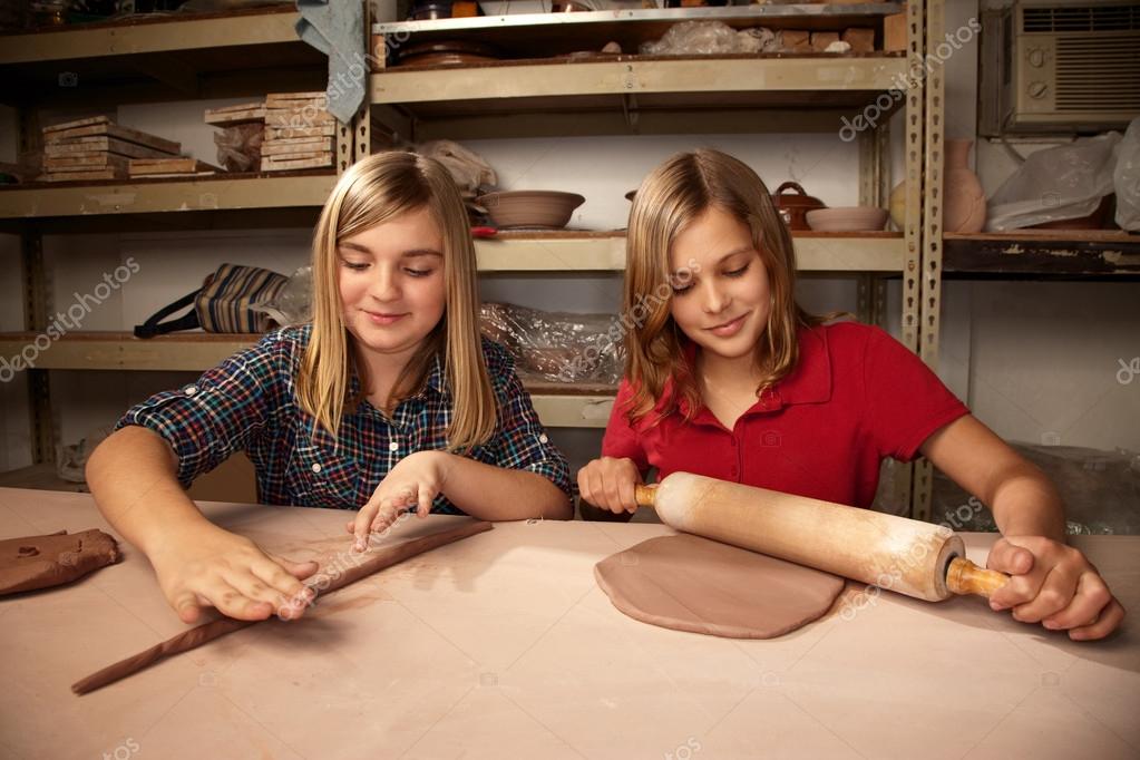 Cute young girls in a clay studio — Stock Photo © creatista #39896667