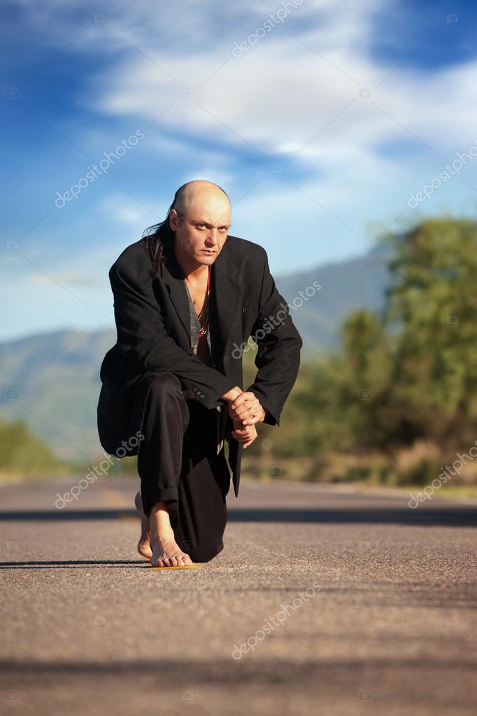 Man in the middle of a road Stock Photo by ©creatista 40381835