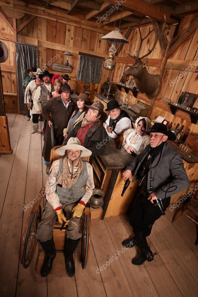 Relaxed Crowd with Guns in Saloon — Stock Photo © creatista #40888483