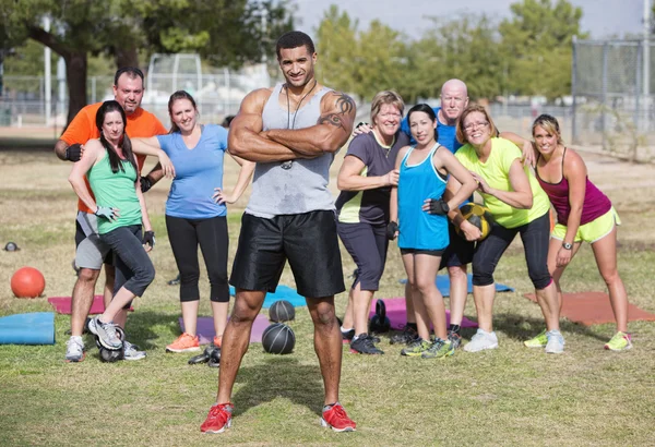 Confident Instructor with Fitness Class - Stock Image - Everypixel