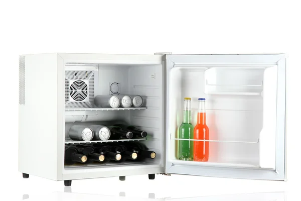 Mini fridge full of bottles of alcoholic beverages and water isolated ...