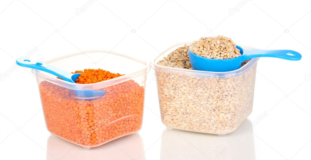 Measuring spoons and plastic containers with grain isolated on white ...