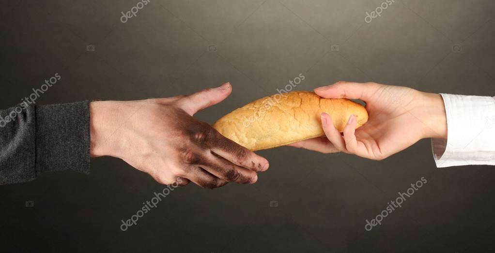Helping the homeless, on black background close-up — Stock Photo ...