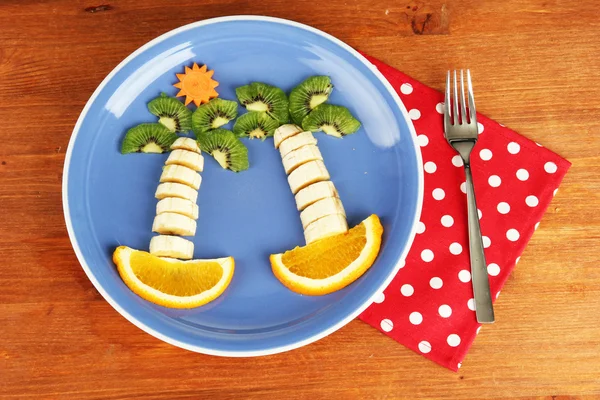 Fun food for kids on wooden background Stock Photo by ©belchonock 18169833