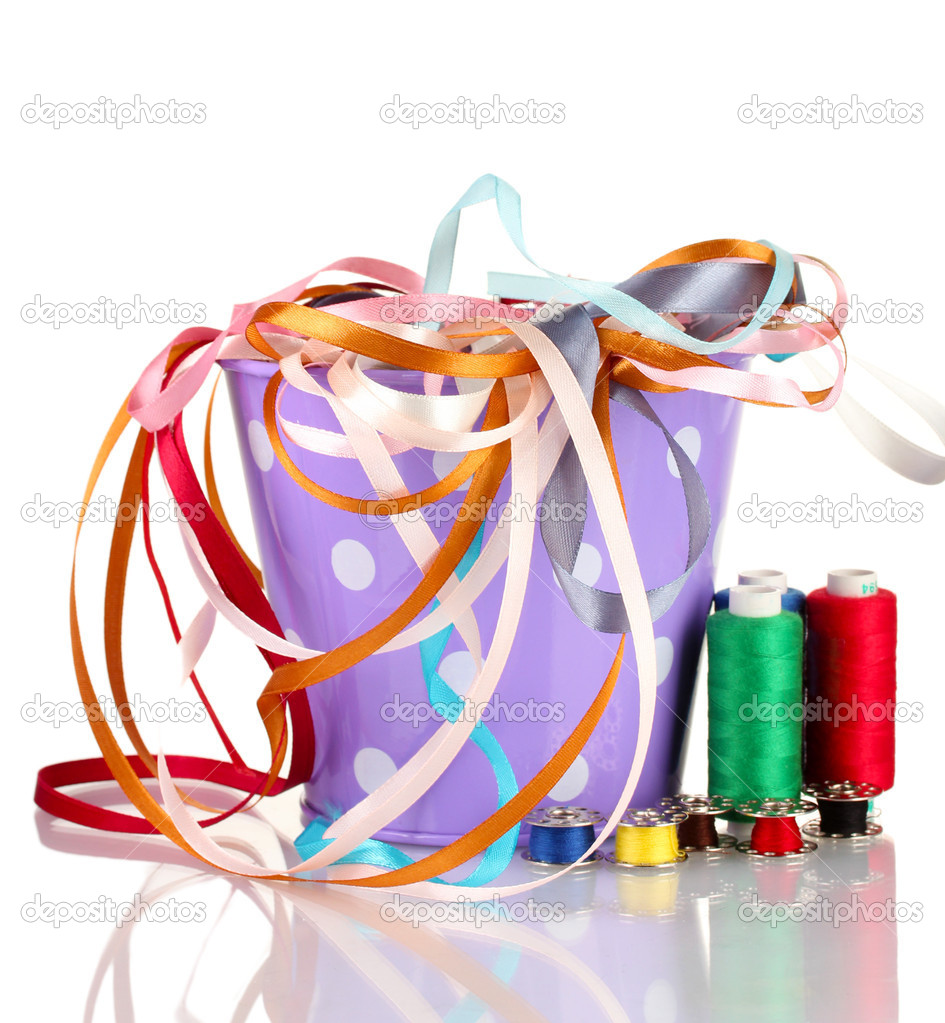 Color bucket with multicolor ribbons and thread isolated on white Stock ...