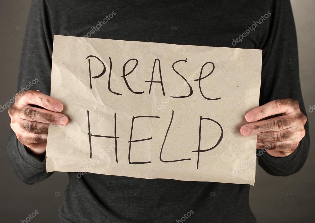 Homeless man asks for help, on black background close-up — Stock Photo ...
