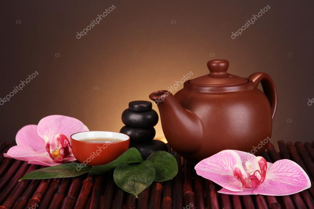Chinese tea ceremony on bamboo table on brown background — Stock Photo ...