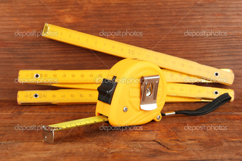 Tape measure and ruler on wooden background Stock Photo by ©belchonock ...