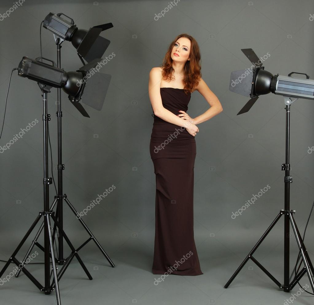 Beautiful professional female model resting between shots in ...