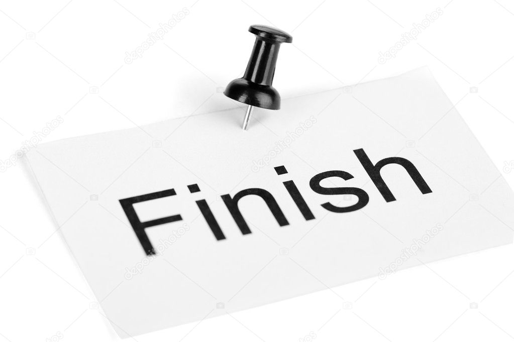 Spillo a pressione sulla carta con la parola fine scritta su di esso ...