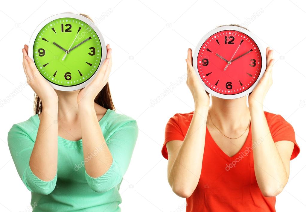 Girls holding clocks over face isolated on white Stock Photo by ...