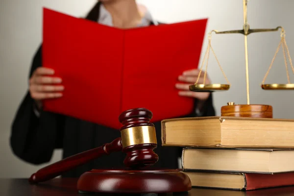 Judge read verdict on grey background Stock Photo by ©belchonock 20326007