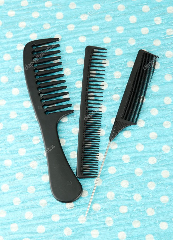 Black combs on color background Stock Photo by ©belchonock 21541683