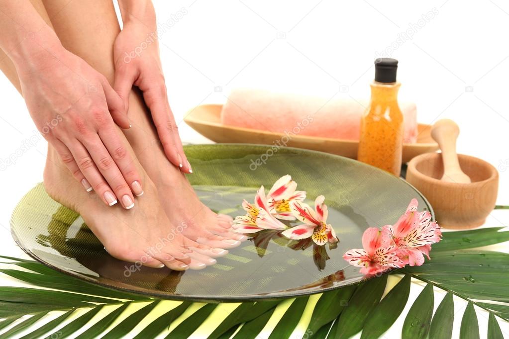 Female feet in spa bowl with water, isolated on white — Stock Photo ...