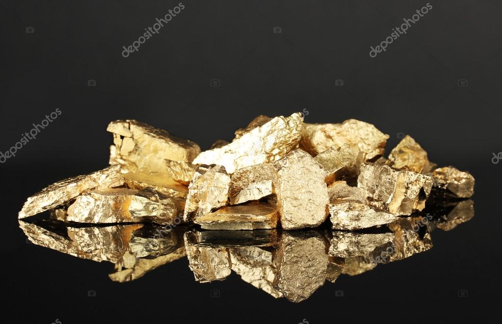 Golden nuggets on dark background Stock Photo by ©belchonock 22475643