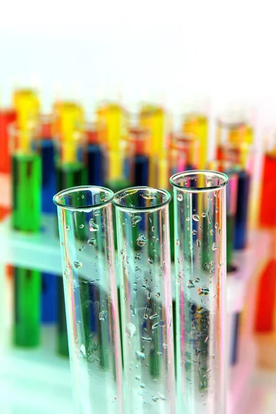 Colorful test tubes close-up — Stock Photo © belchonock #23604781