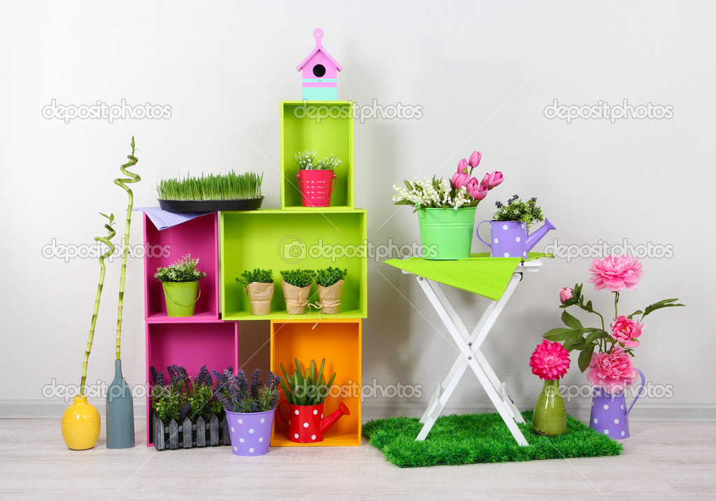 Beautiful colorful shelves with decorative elements standing in room ...