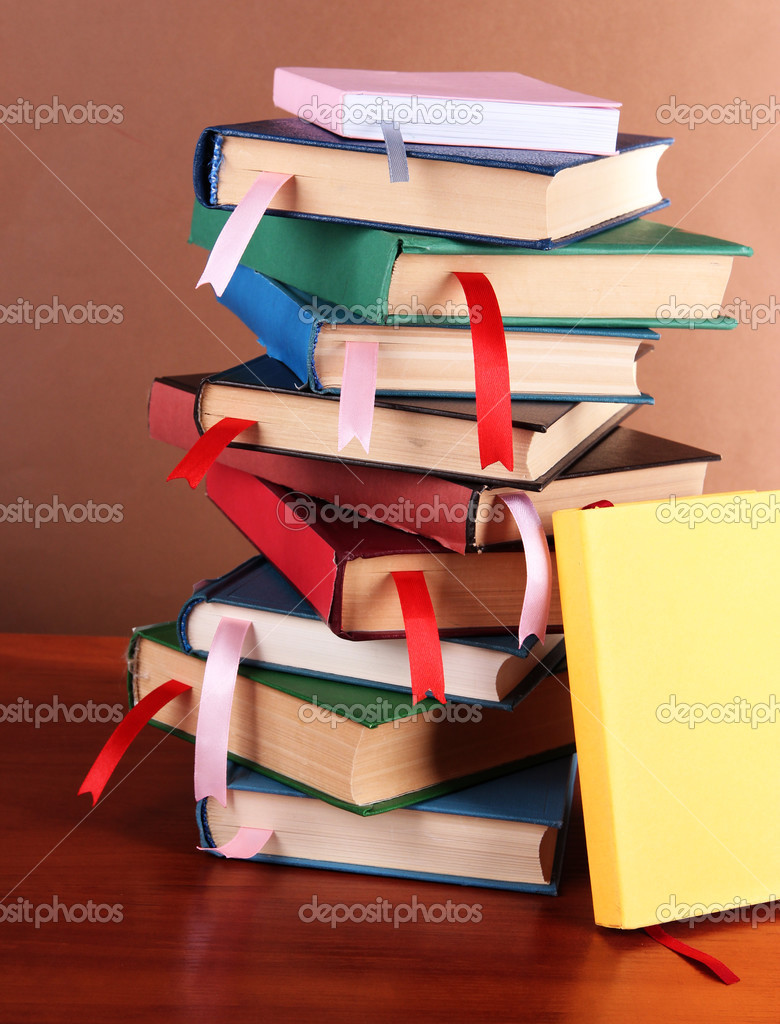 Many books with bookmarks on brown background — Stock Photo ...