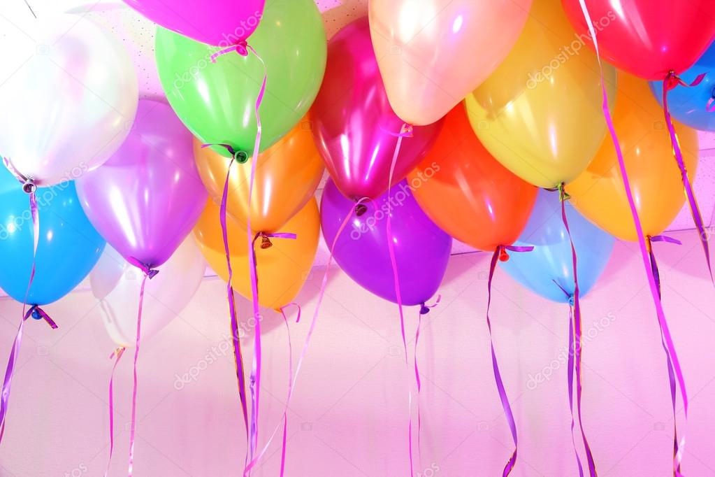 Many bright balloons under ceiling close-up Stock Photo by ©belchonock ...