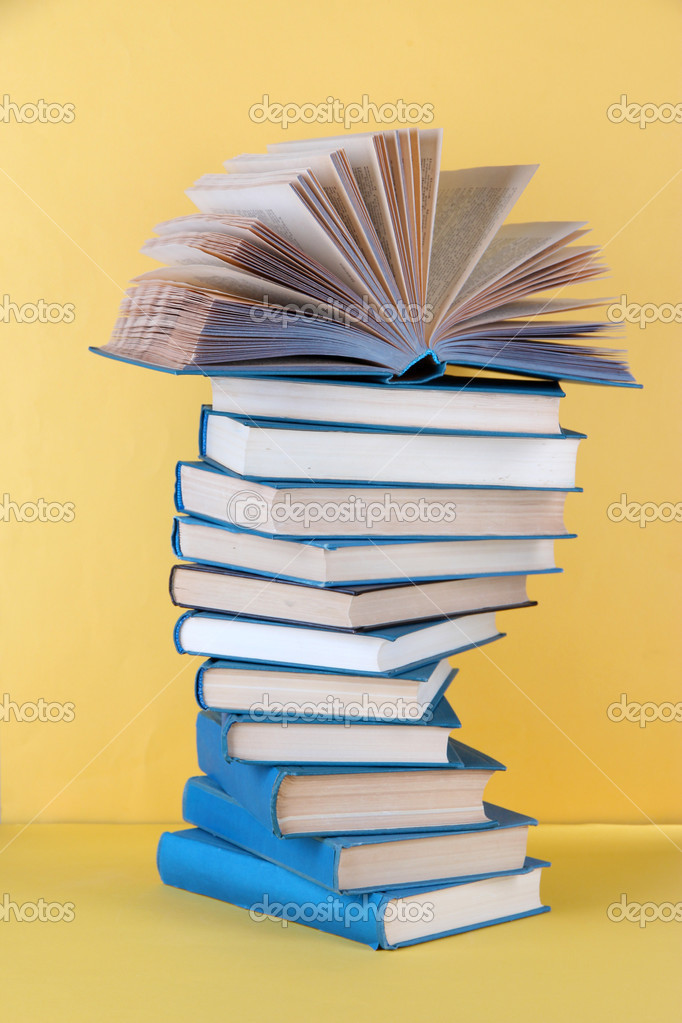 Spiral books on beige background — Stock Photo © belchonock #24624621