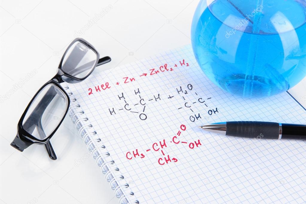 Test tube with colorful liquid and formulas isolated on white — Stock ...