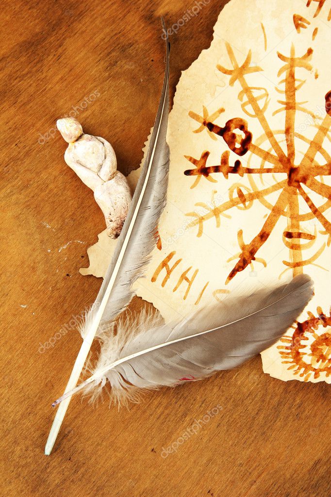 Old paper with symbols, on wooden background Stock Photo by ©belchonock ...