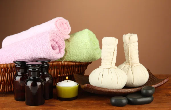 Textile massage spa equipment on a brown background Stock Photo by ...