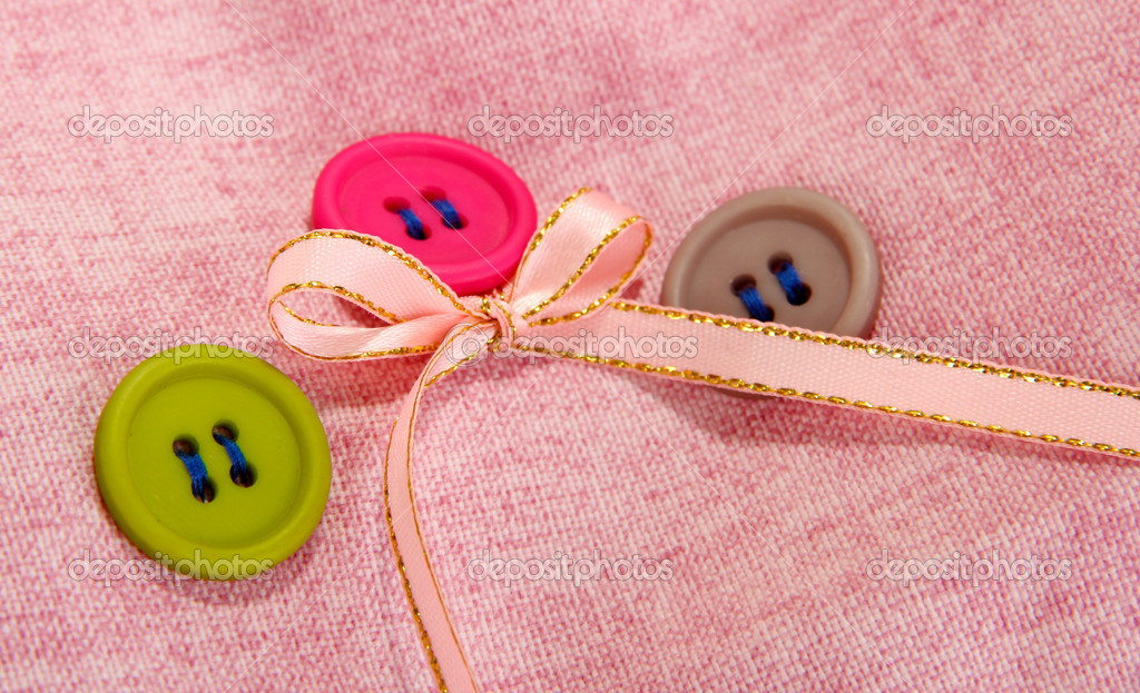 Three buttons on light cloth Stock Photo by ©belchonock 25540633