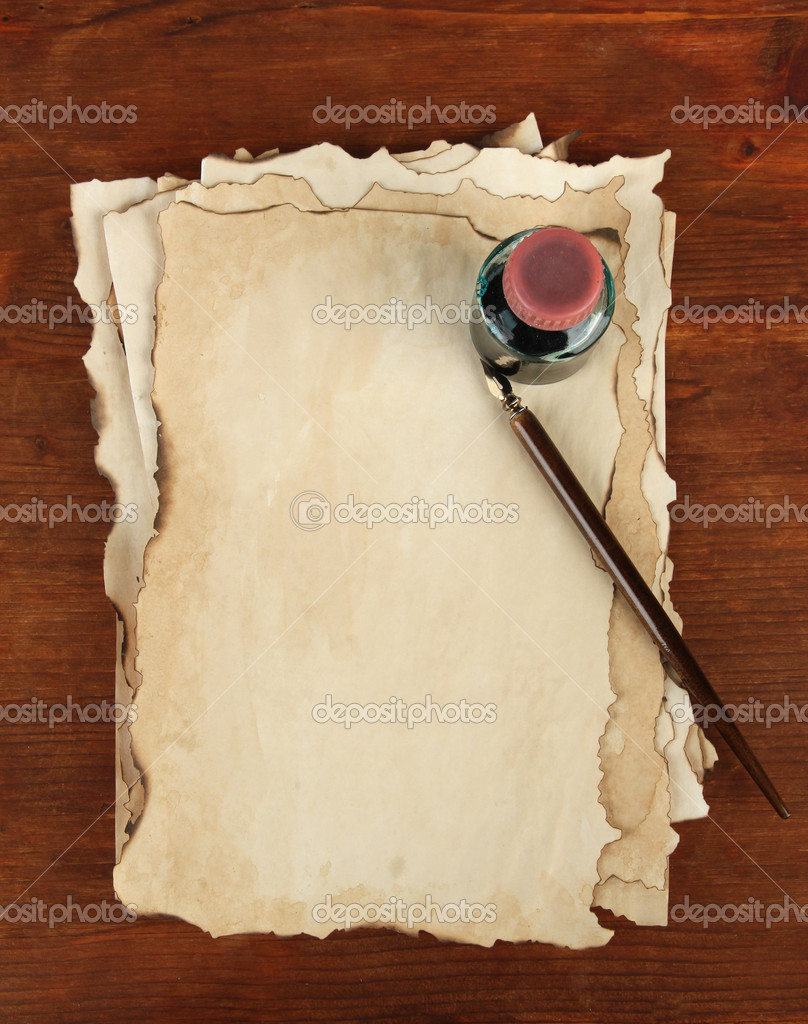 Old paper, ink and ink pen on wooden background Stock Photo by ...