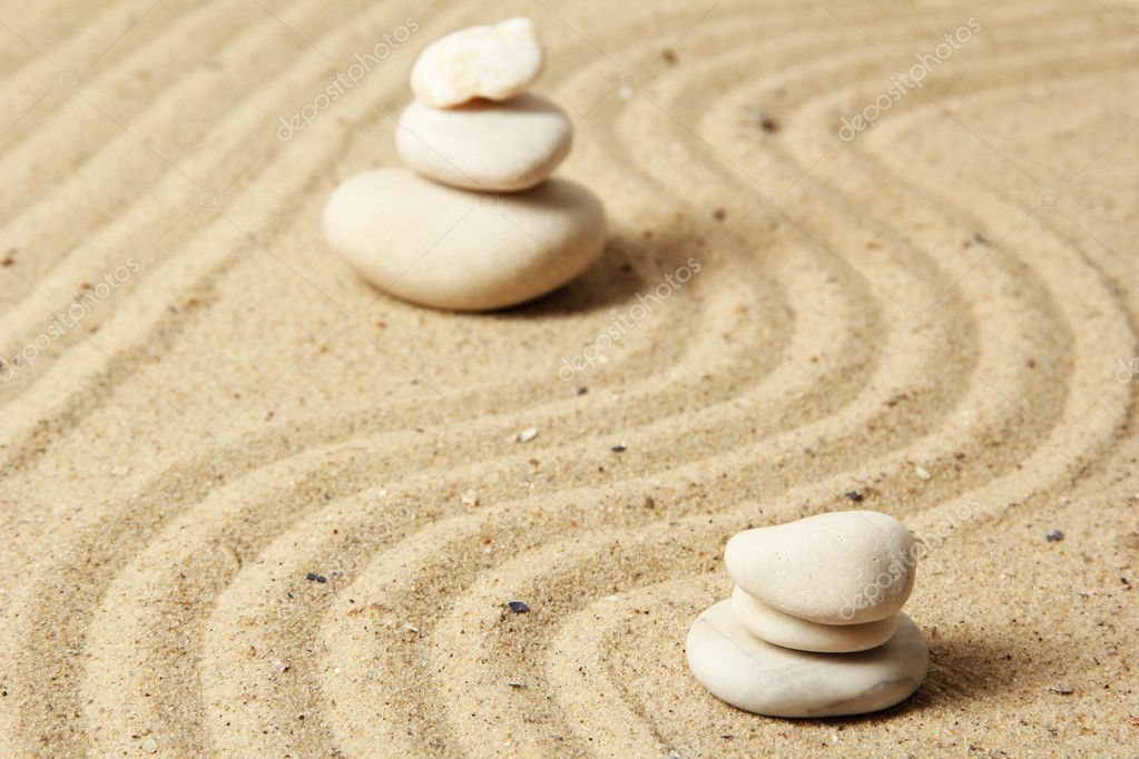 Zen garden with raked sand and round stones close up Stock Photo by ...