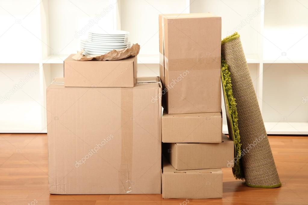 Moving boxes in empty room — Stock Photo © belchonock #27368719