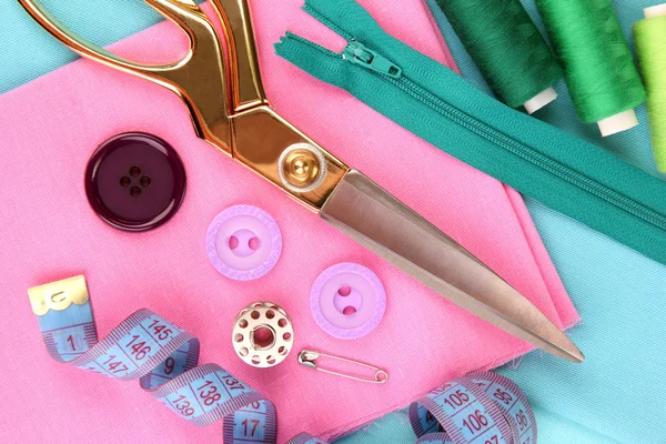 Sewing accessories and fabric close-up Stock Photo by ©belchonock 22527361
