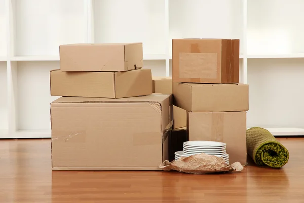 Moving boxes in empty room — Stock Photo © belchonock #27368719