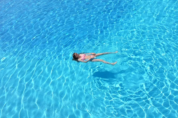 Relaxing in swimming pool — Stock Photo © belchonock #28605547