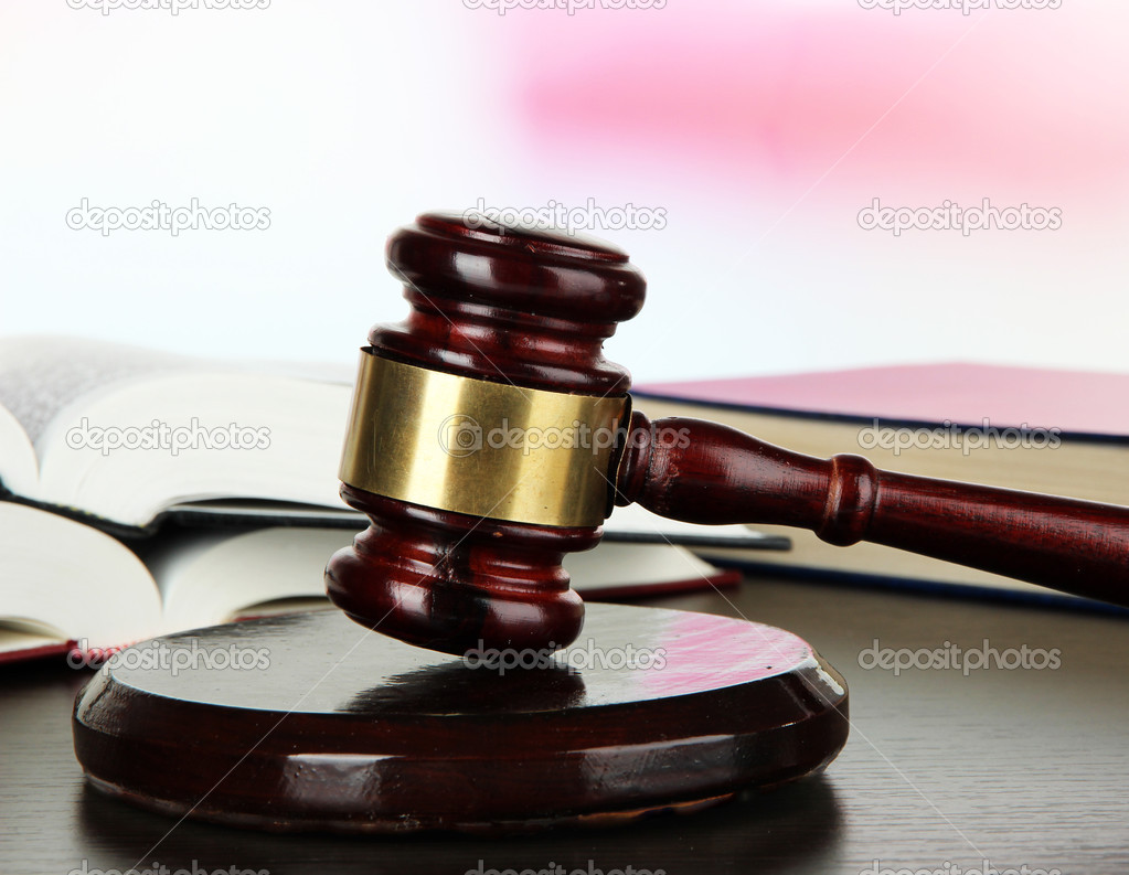 Gavel and books on table on light background Stock Photo by ©belchonock ...