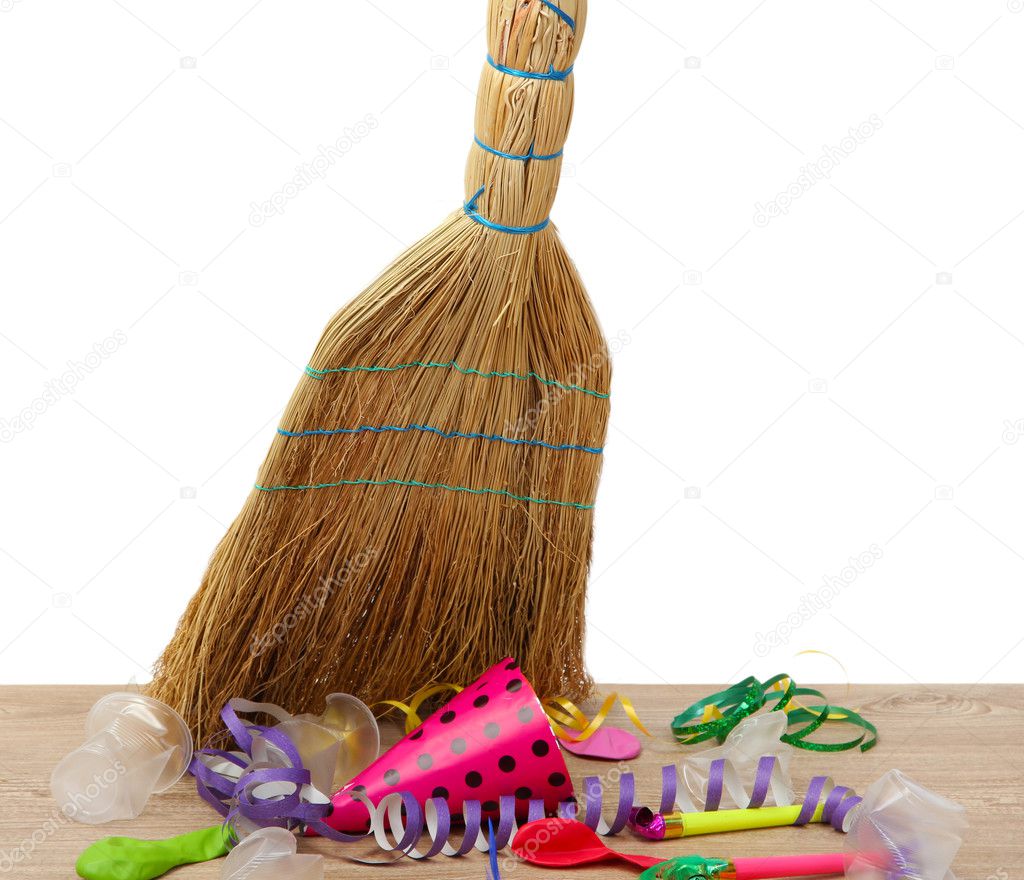 Broom sweep the trash after a party on white background close-up Stock ...