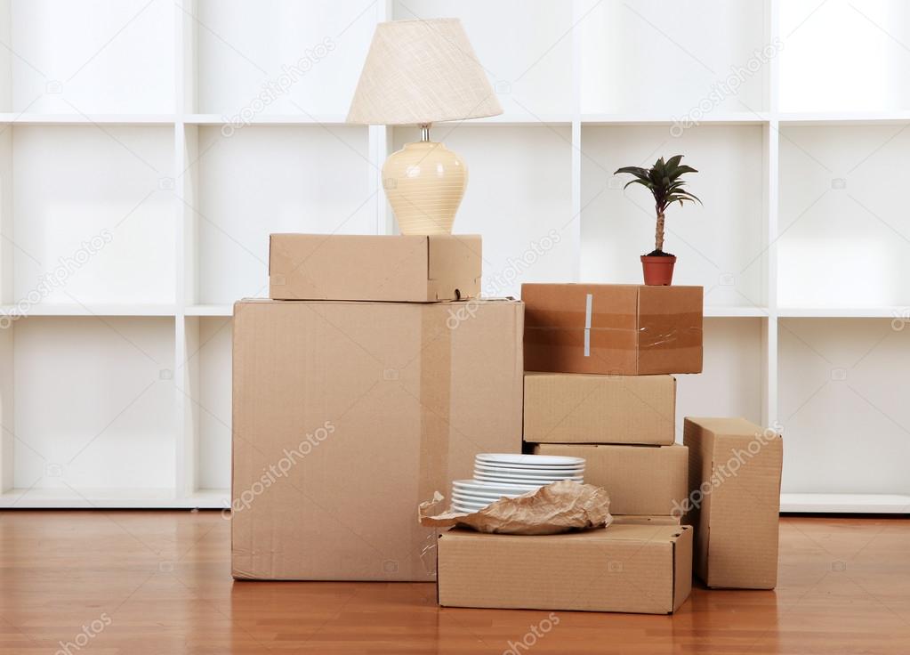 Moving boxes in empty room ⬇ Stock Photo, Image by © belchonock #29311947