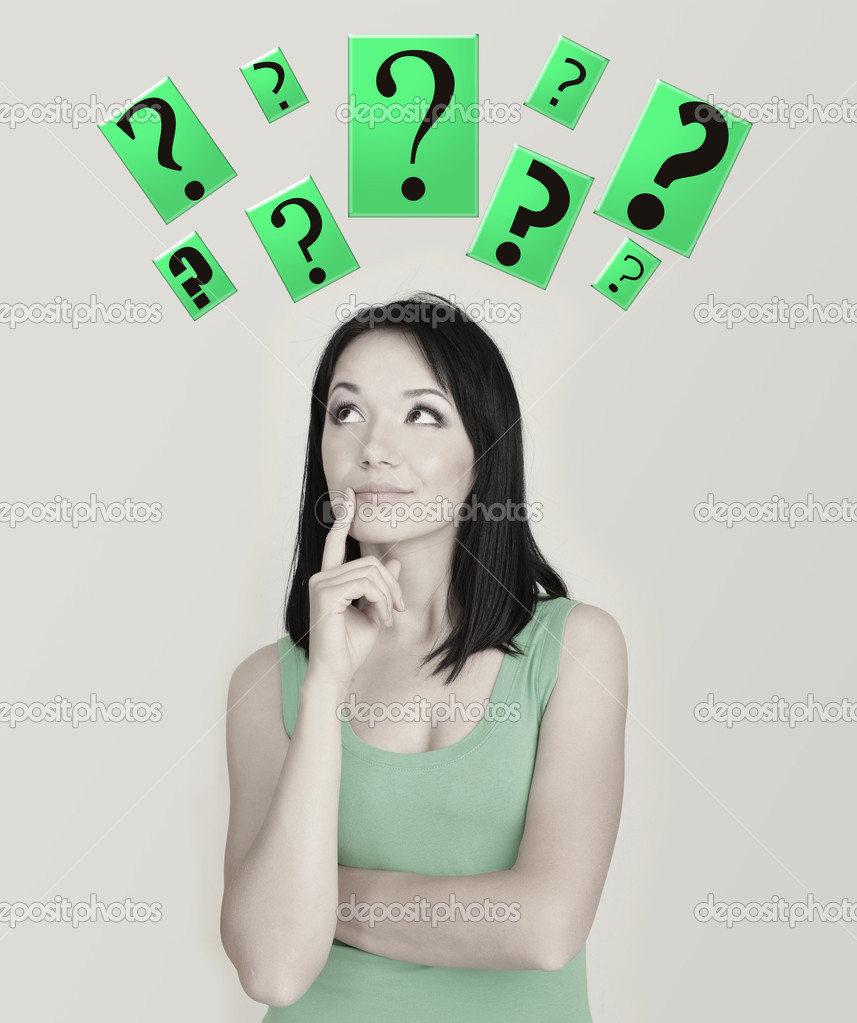 Girl thinking surrounded by question marks on beige background — Stock ...