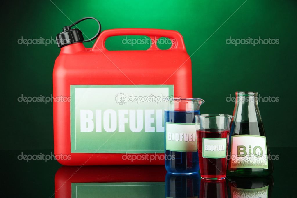 Bio fuels in canister and vials on green background Stock Photo by ...