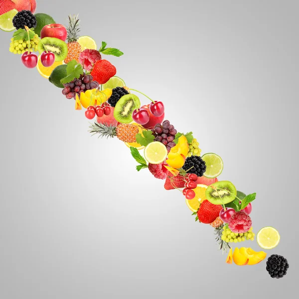 Flight of fruits and berries in water on white background Stock Photo ...