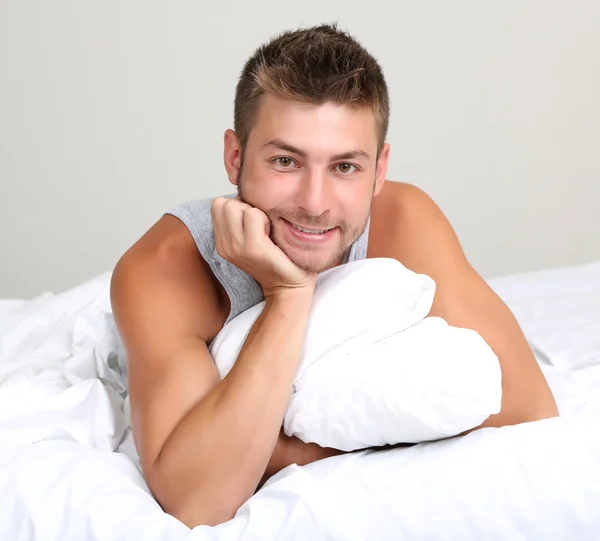 Top view of muscular young man looking at camera with sensual smile ...