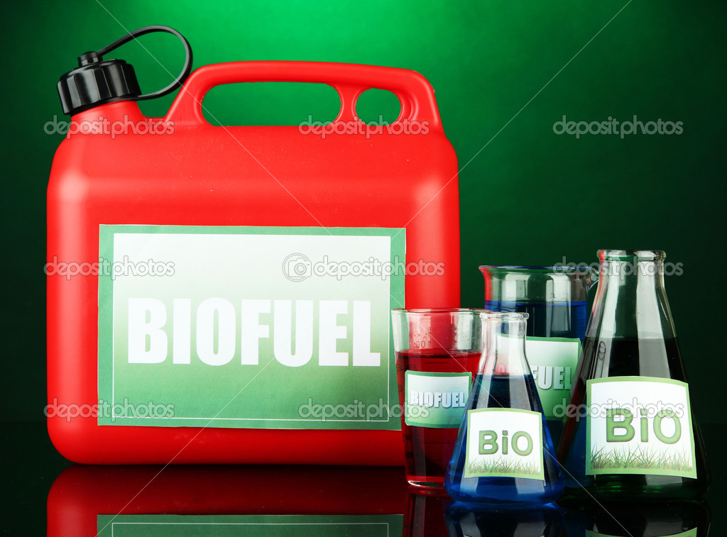 Bio fuels in canister and vials on green background Stock Photo by ...