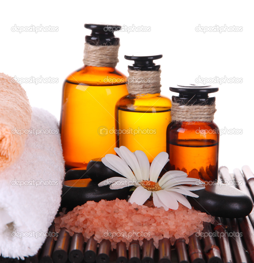 Beautiful spa setting with flower on bamboo mat on white background ...