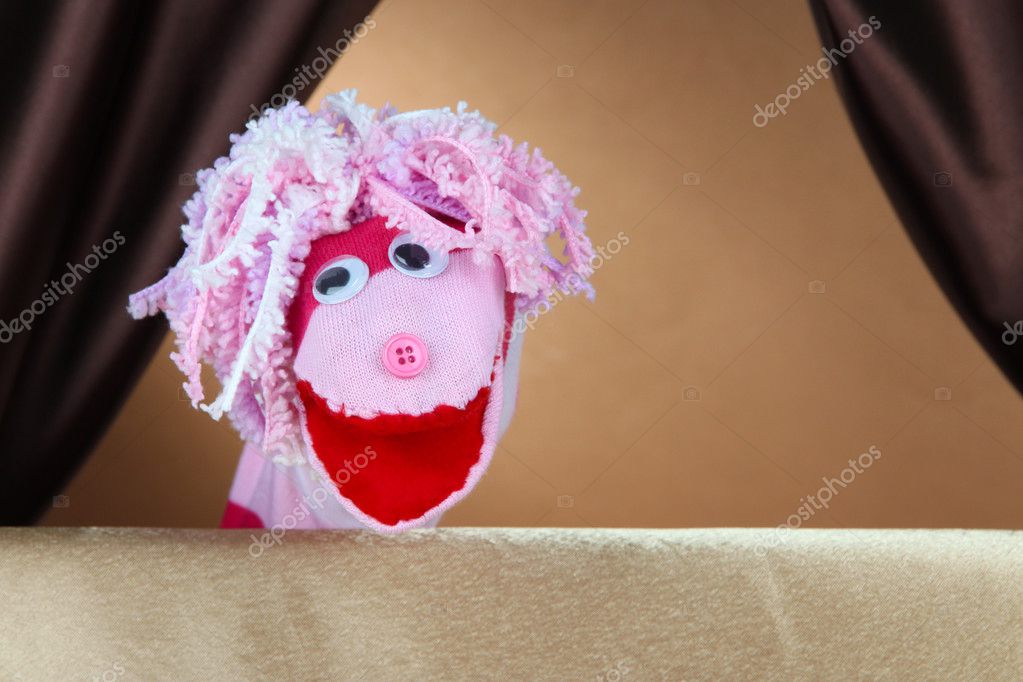Puppet show on brown background Stock Photo by ©belchonock 32684919