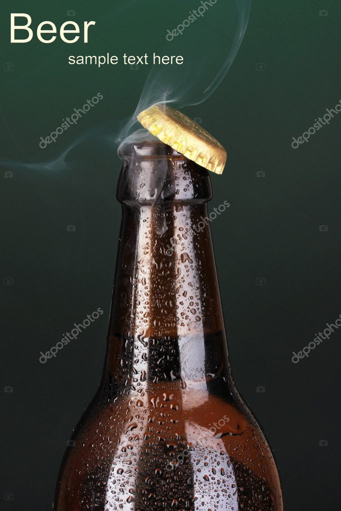 Top of open wet beer bottle on dark background — Stock Photo ...