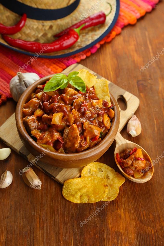 Chili Corn Carne - traditional mexican food, in wooden bowl, on napkin ...