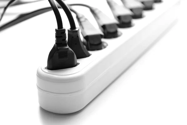 Overloaded power board, isolated on white Stock Photo by ©belchonock ...