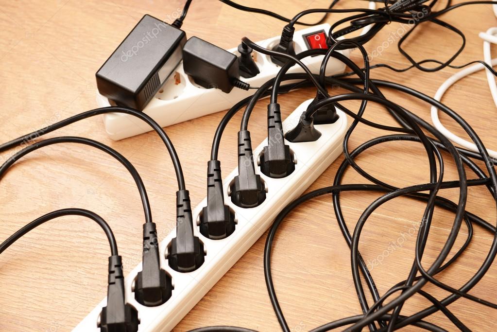 Overloaded power boards, on wooden floor background Stock Photo by ...