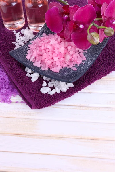 Beautiful spa composition with spring flowers on wooden background ...